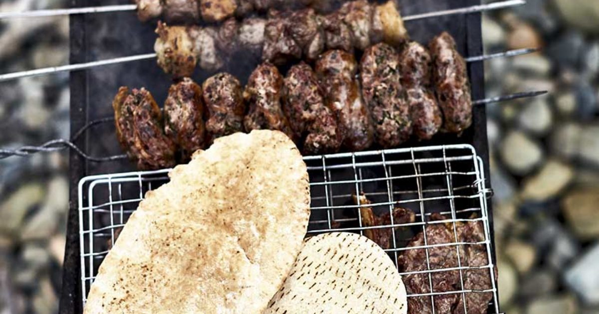 Food and Travel Magazine | Adana kofte with pitta bread, spicy tomato…